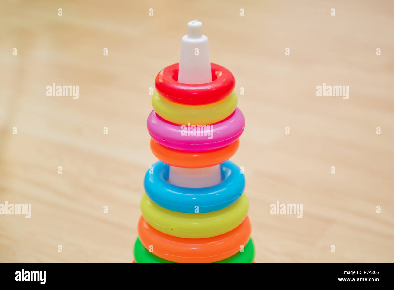 Educational toys for toddlers, gripping rings, isolated on yellow ...