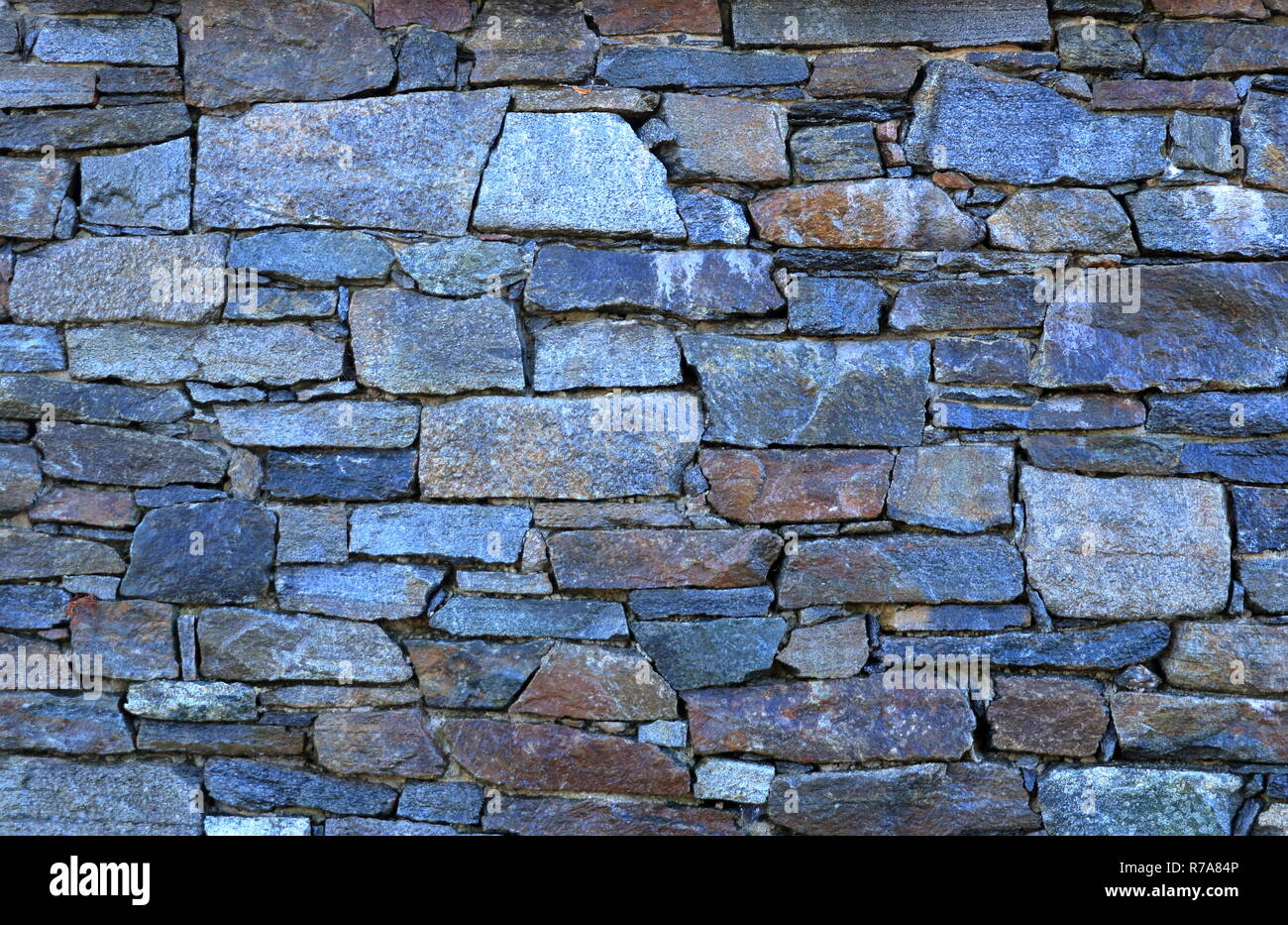 Stone wall texture background in natural color Stock Photo - Alamy
