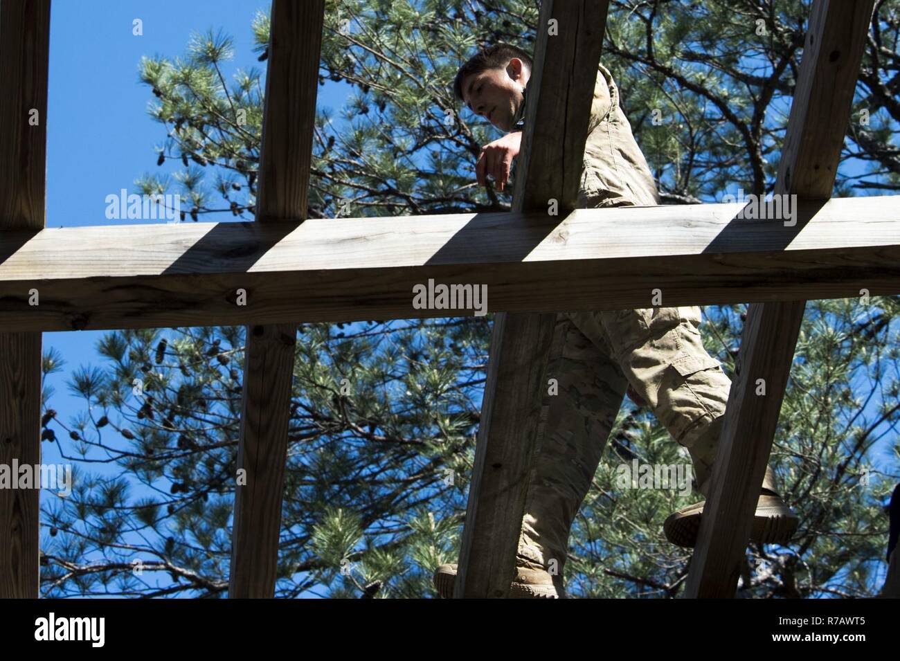 A U.S. Army Ranger traverses an obstacle at the Darby Queen obstacle ...