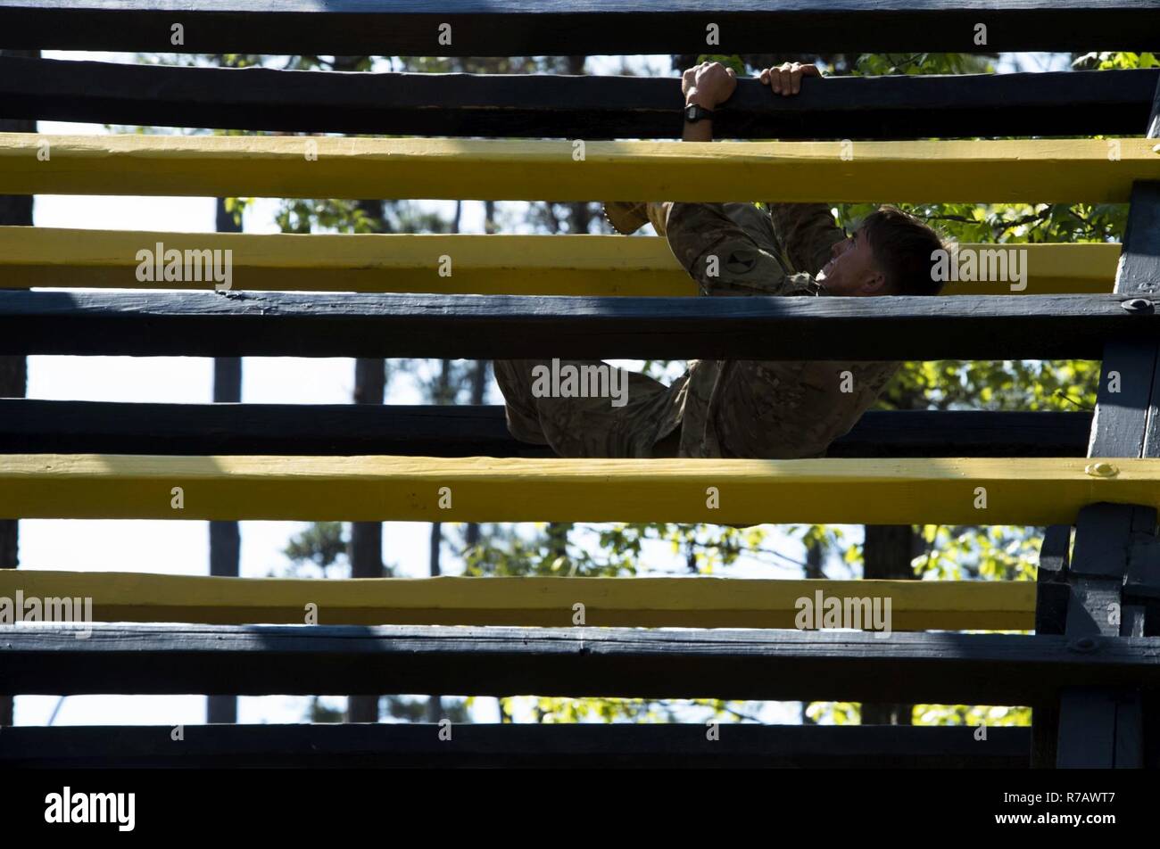 U.S. Army Capt. Michael Hauser, 7th Infantry Division, climbs an ...