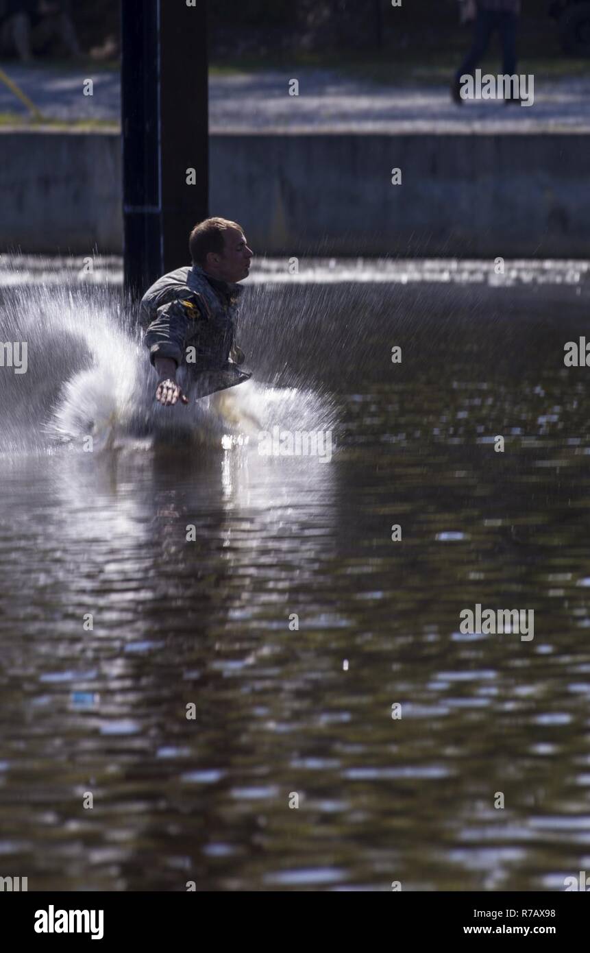 A U.S. Army Ranger drops into the water at the Combat Water Survival ...