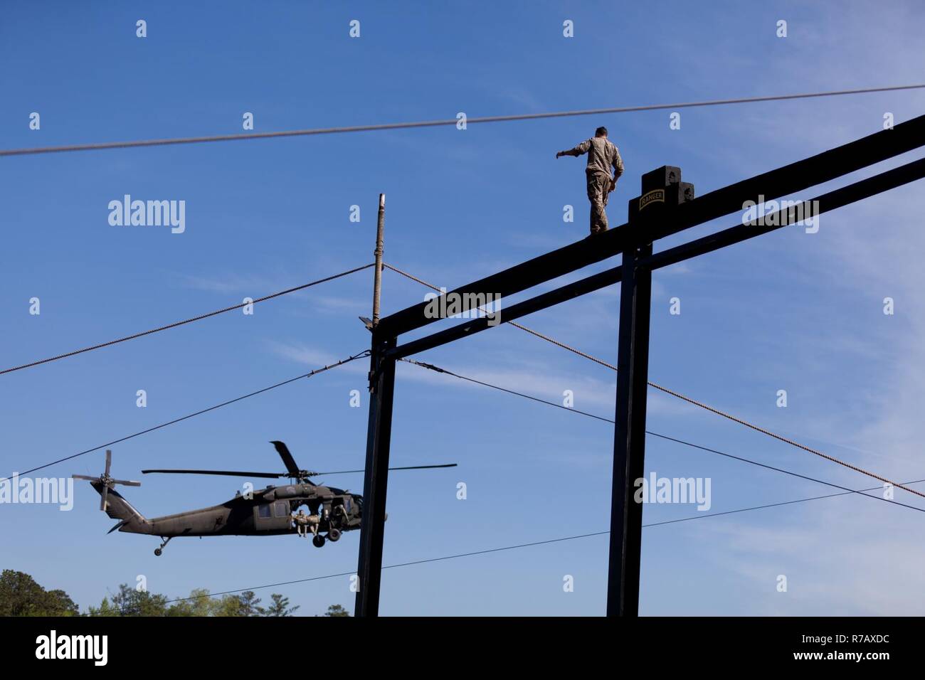 A U.S. Army Ranger walks across a beam during the Best Ranger ...