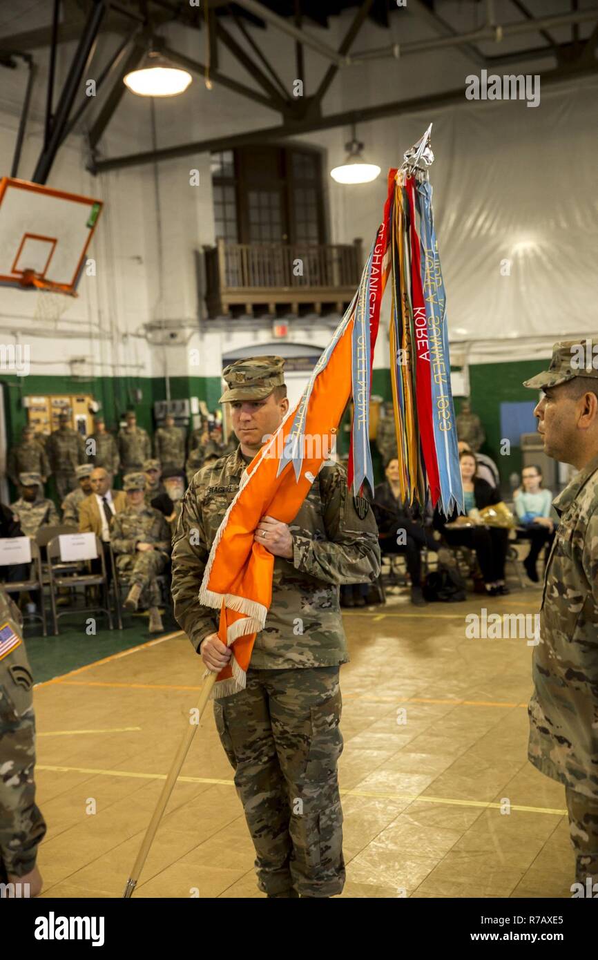 U.S. Army Maj. Ian Seagriff holds the battalion colors as he assumes ...