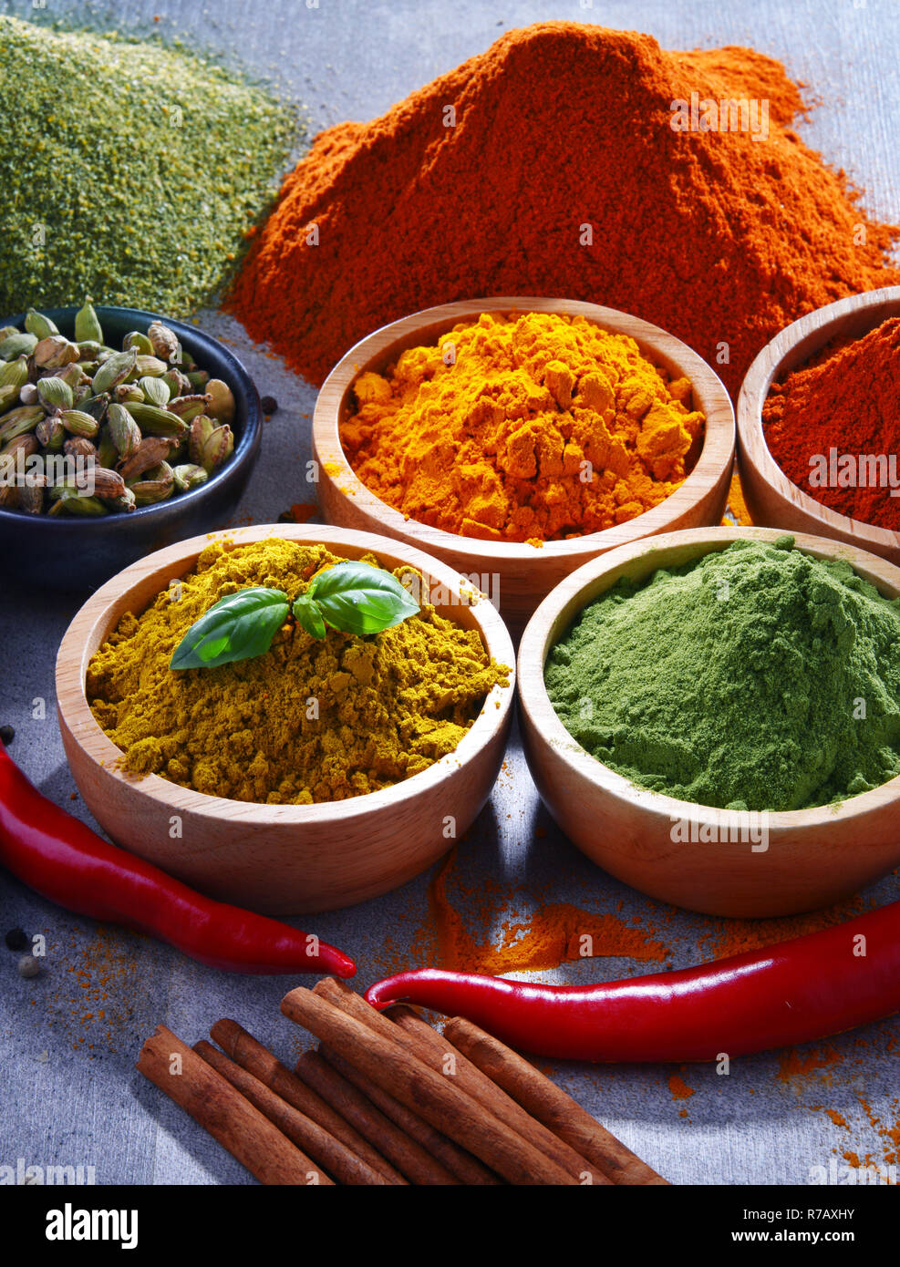 Variety of spices on kitchen table Stock Photo - Alamy