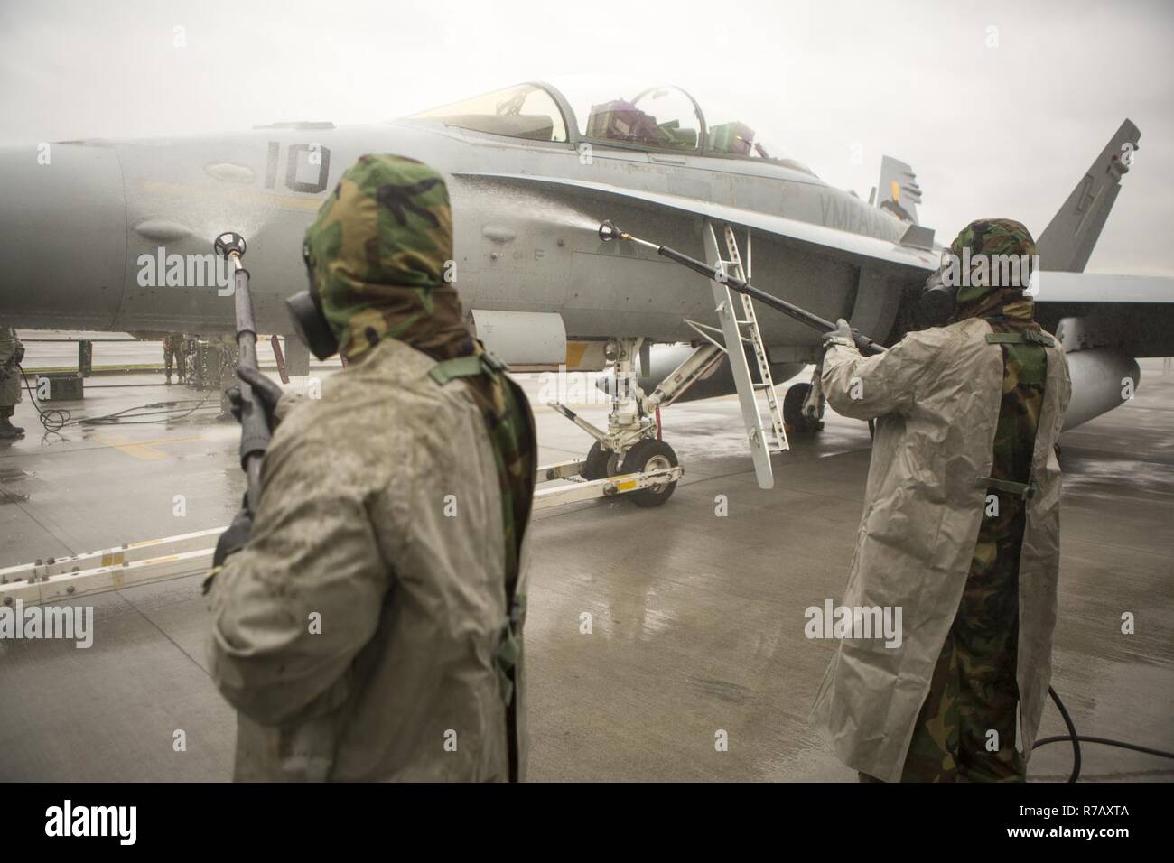 U.S. Marines conduct aircraft decontamination with Marine Fighter ...
