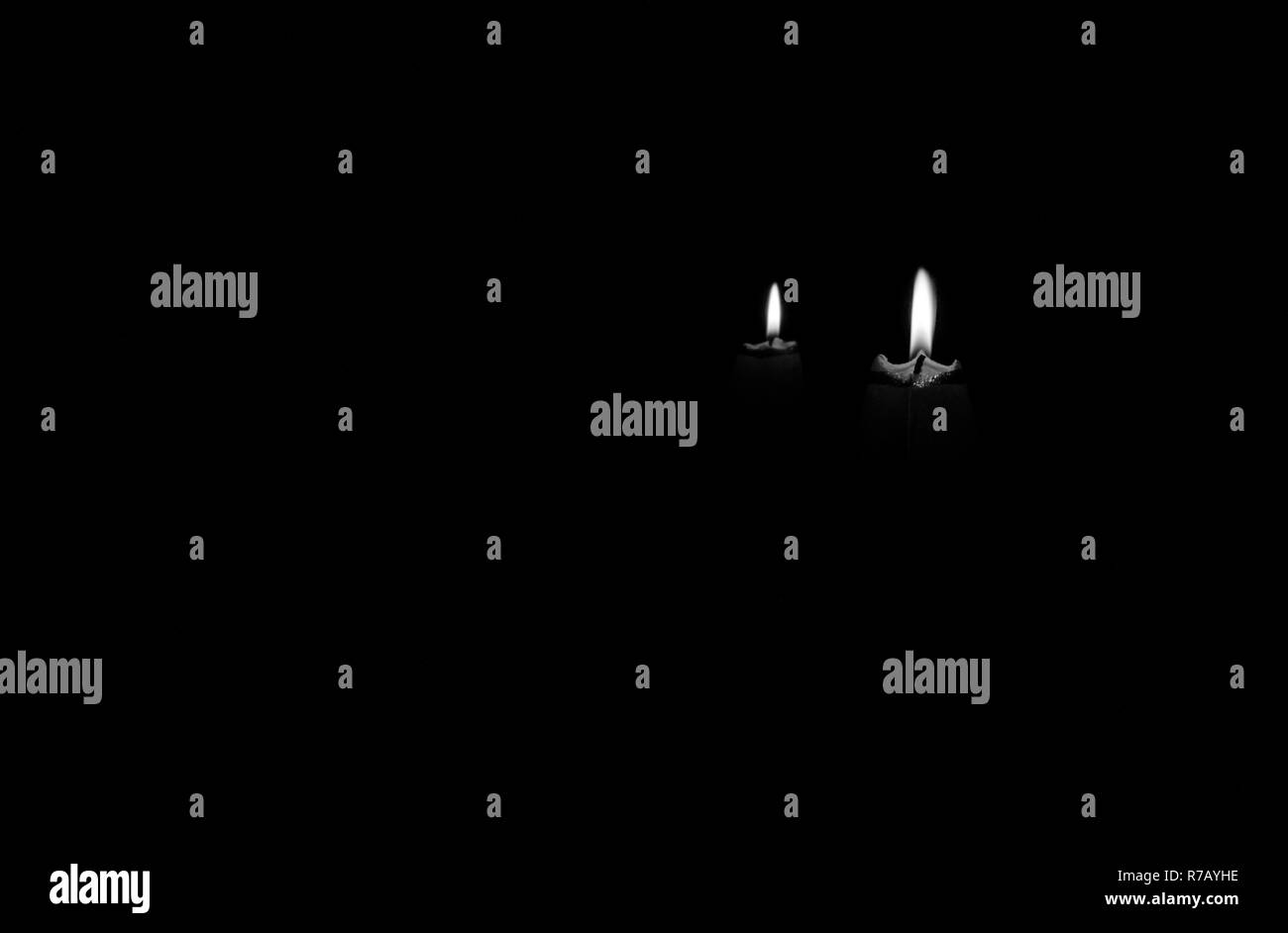 Lit white candles Black and White Stock Photos & Images - Alamy