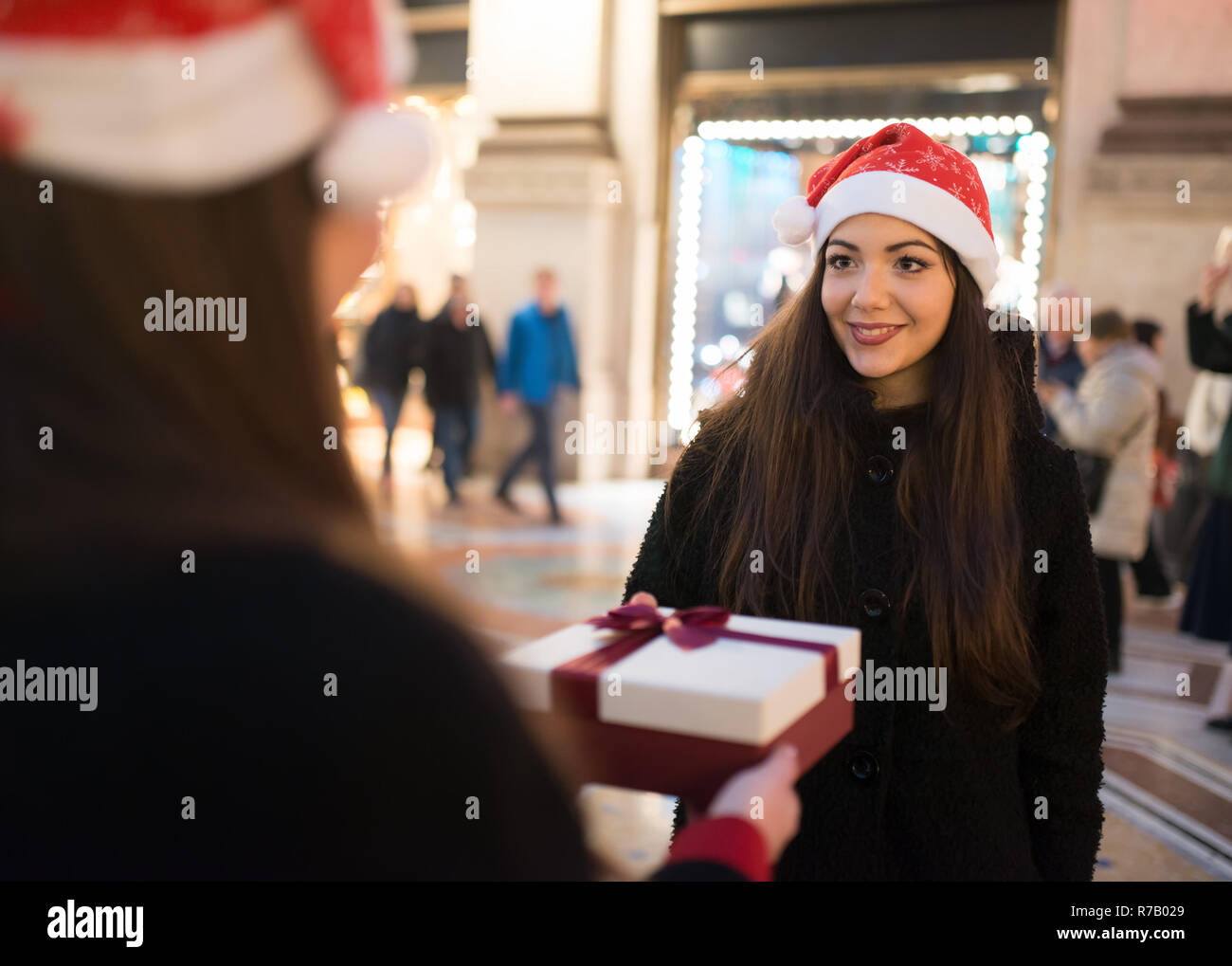 Two women exchanging present hi-res stock photography and images - Alamy