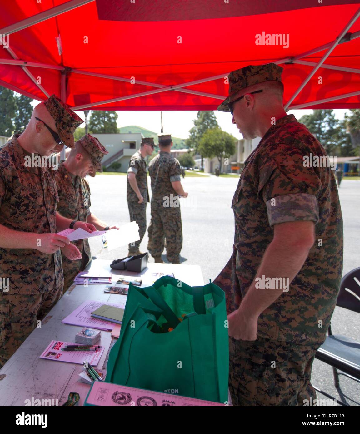 U.S. Marine Gunnery Sgt. Bradley Stalker gives out information about ...