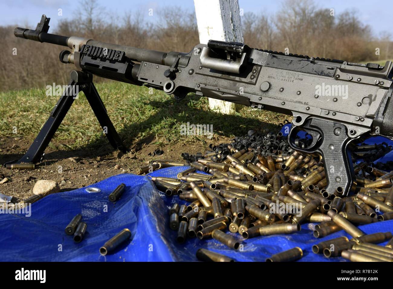An M-240B machine gun rests on the ground at a crew-served weapons ...