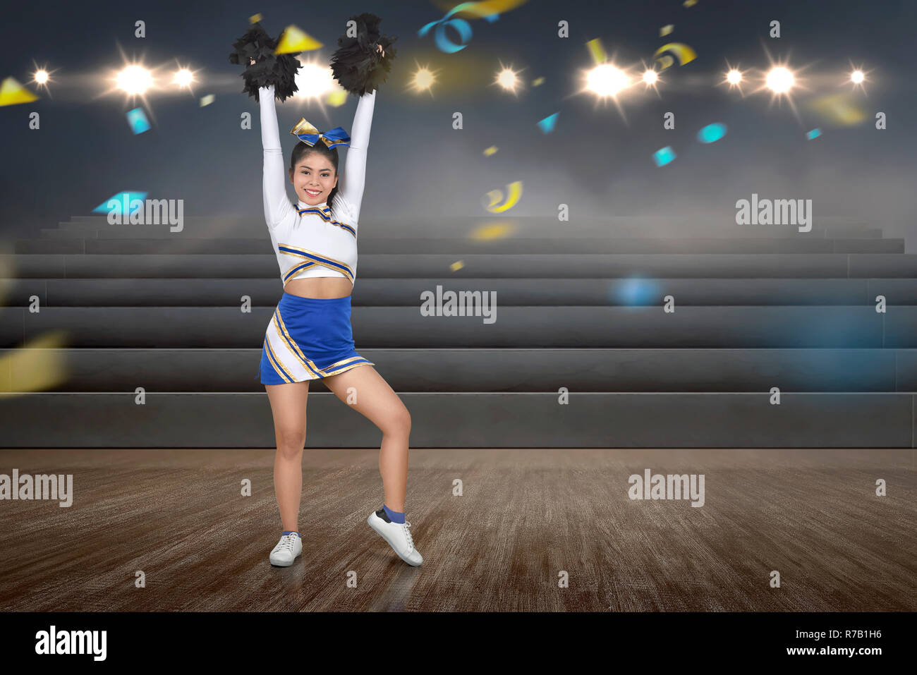 Cheerleader holding pom poms hi-res stock photography and images - Alamy