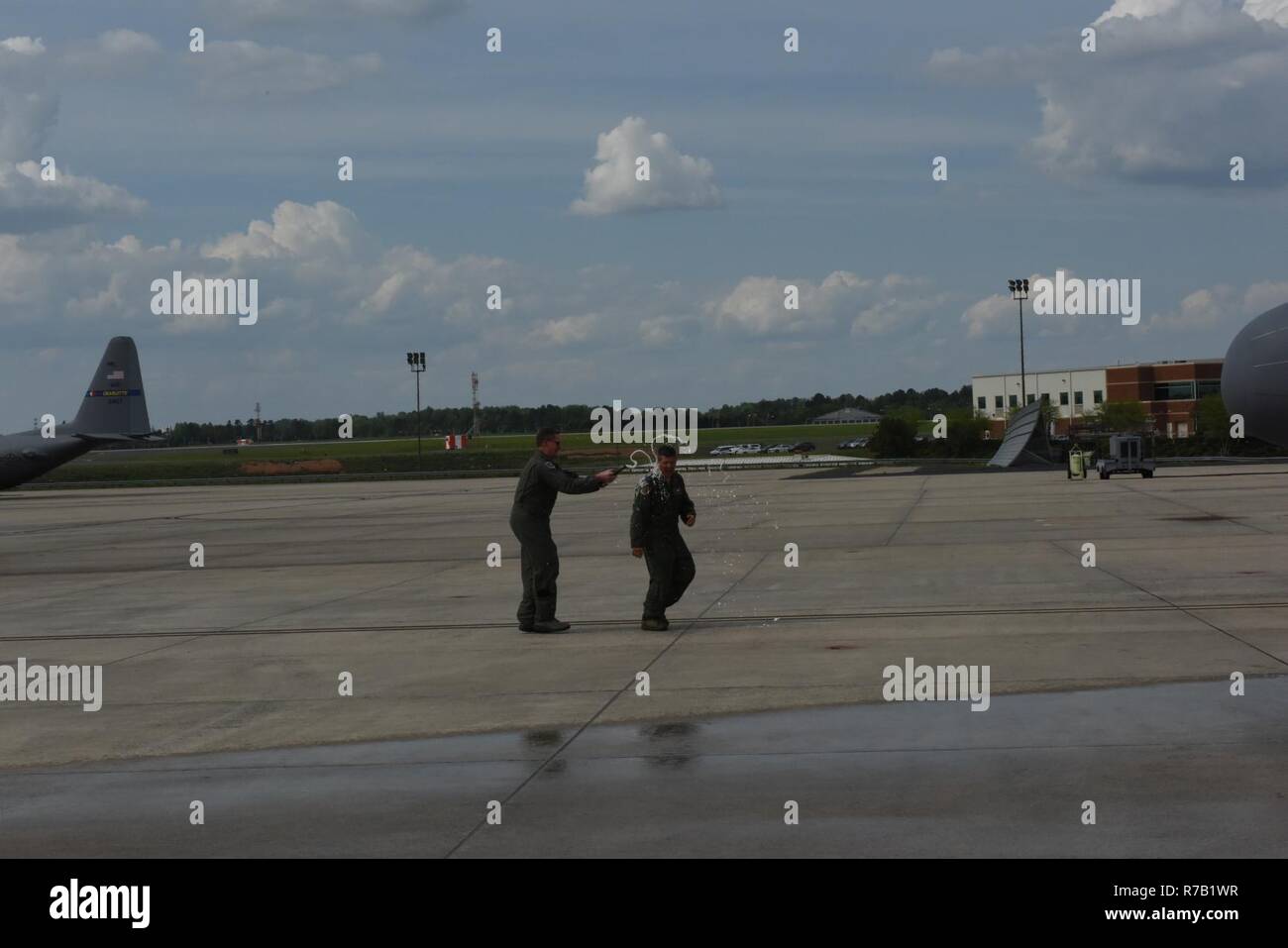 U.S. Air Force Maj. Gen. D. Todd Kelly (right) is drenched in champagne ...