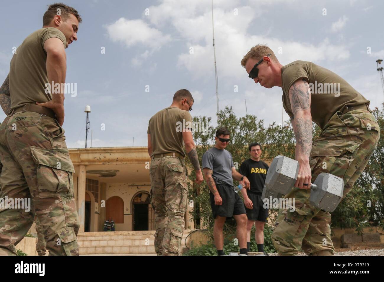 U.S. Army Sgt. 1st Class Daniel Byerly (right) deployed in support of ...