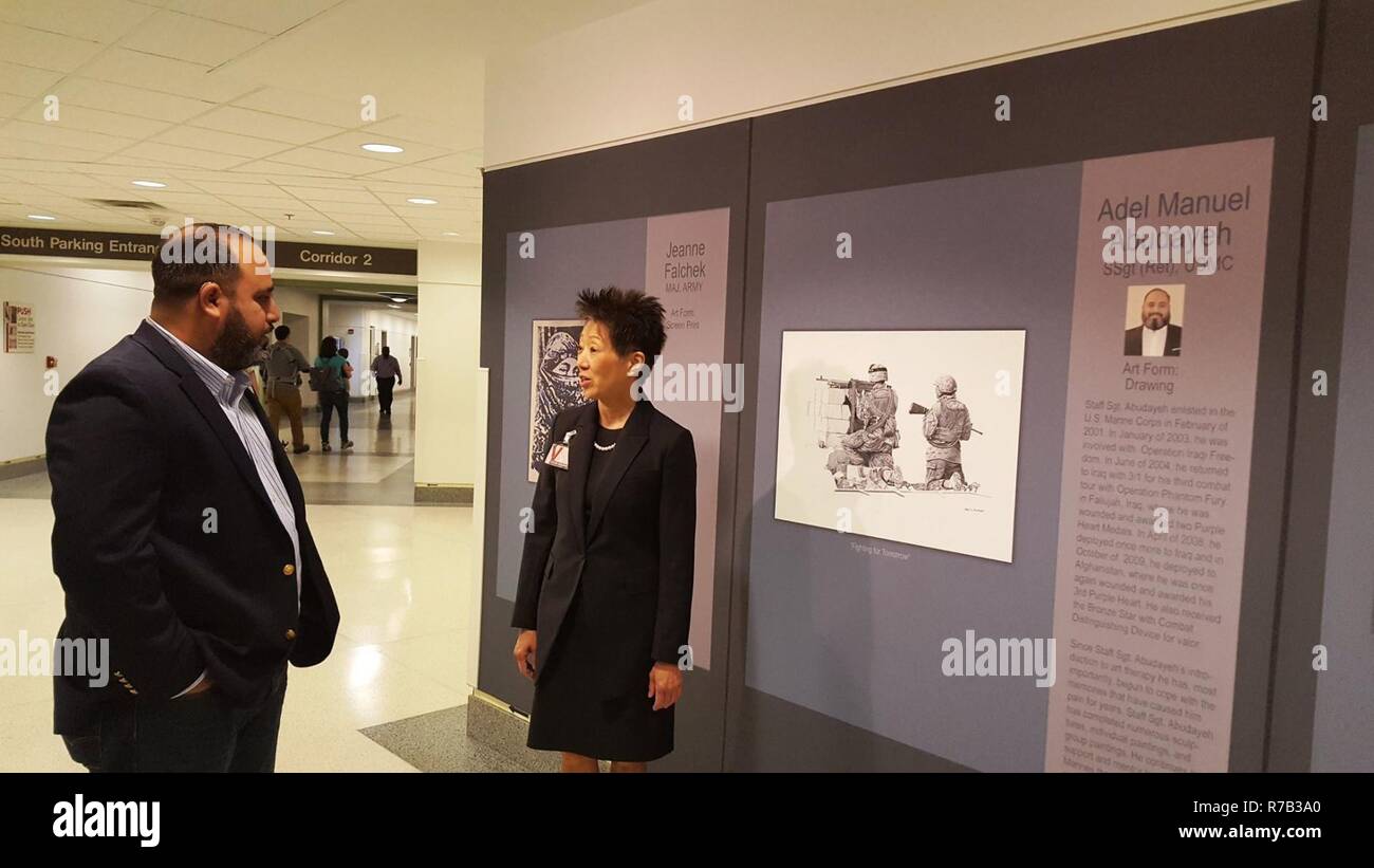 Retired Marine Staff Sgt. Adel Abudayeh speaks with Jane Chu, Chair ...
