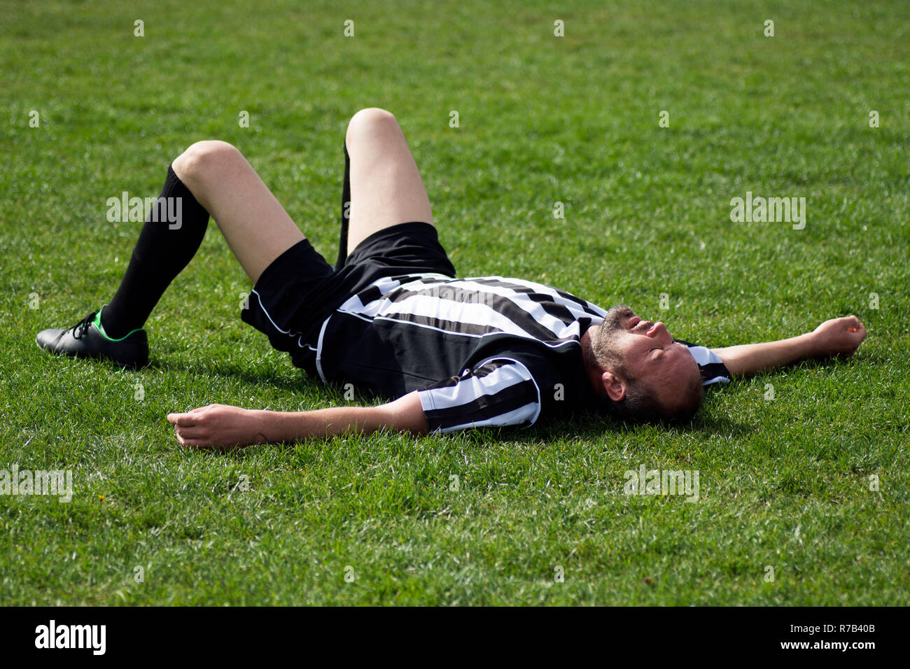 Soccer player lying down hi-res stock photography and images - Alamy