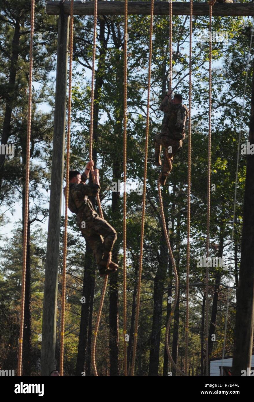 Staff Sgt. Nathan Neuvirth rope climbs at the Malvesti obstacle course ...