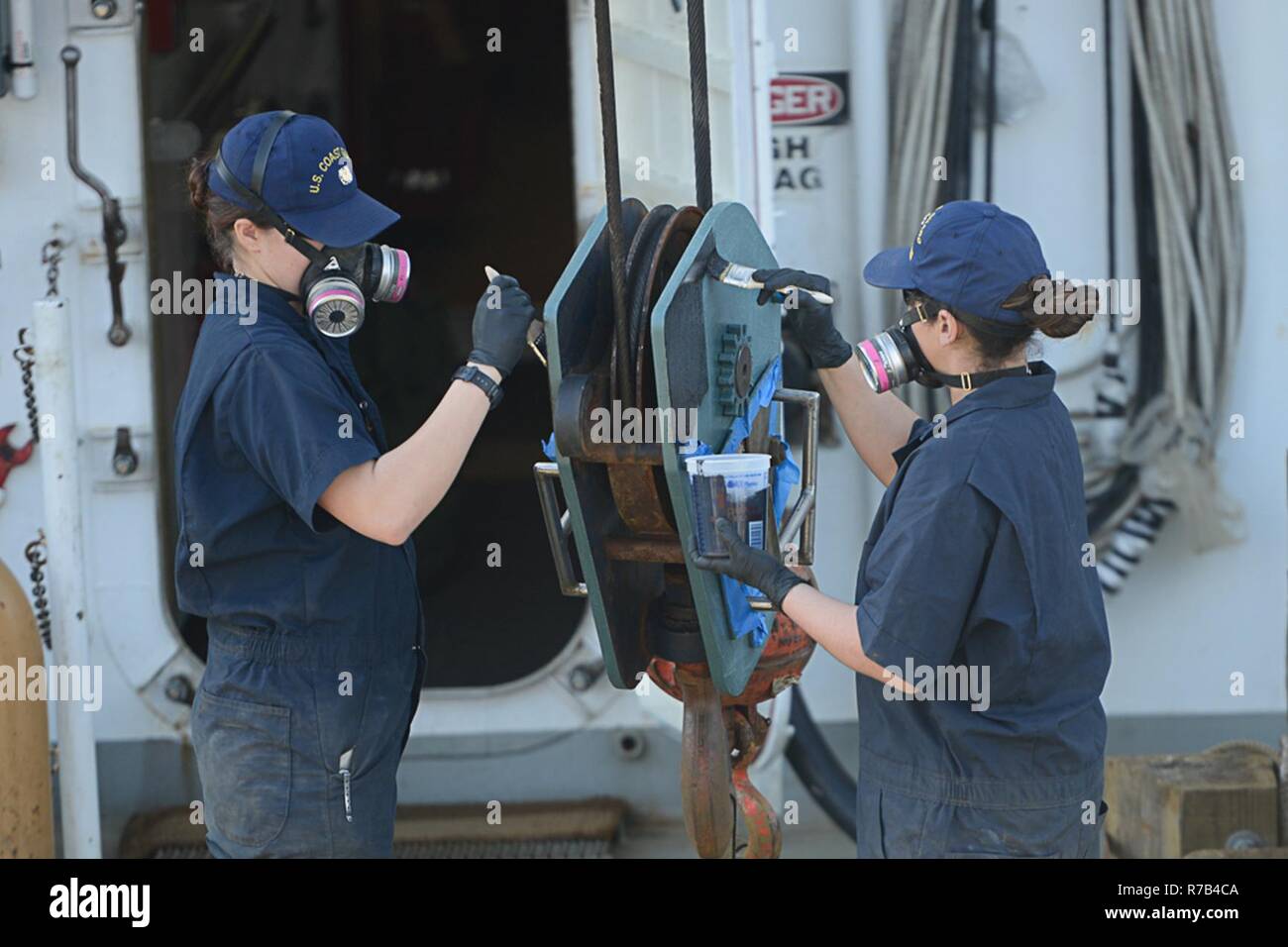 Coast Guard Seaman Lindsay Trujillo and Seaman Morgan Brooks paint the ...
