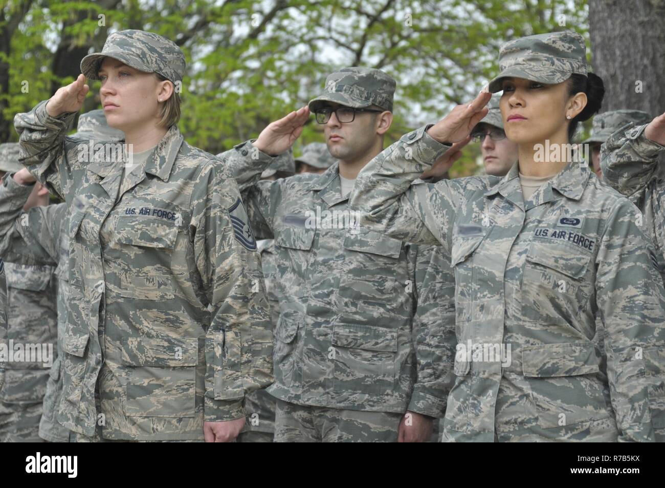 Airmen from the 32nd Intelligence Squadron hold their salutes April 20 ...
