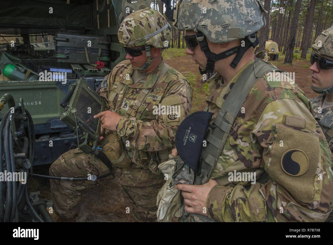 Staff Sgt. Christopher Humphrey (left), a howitzer section chief with ...