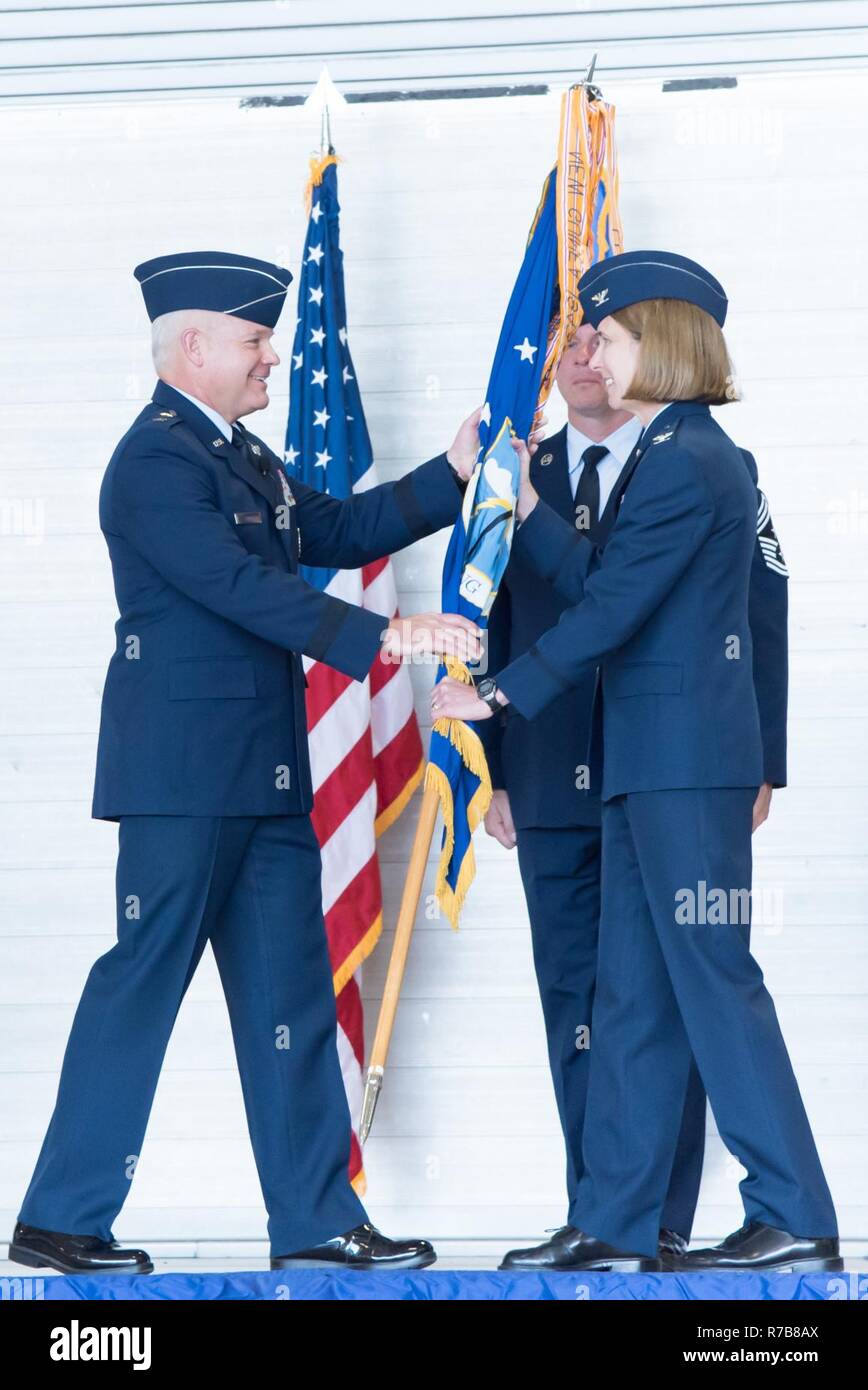 Maj. Gen. John P. Stokes, 22nd Air Force commander,passes the 403rd ...