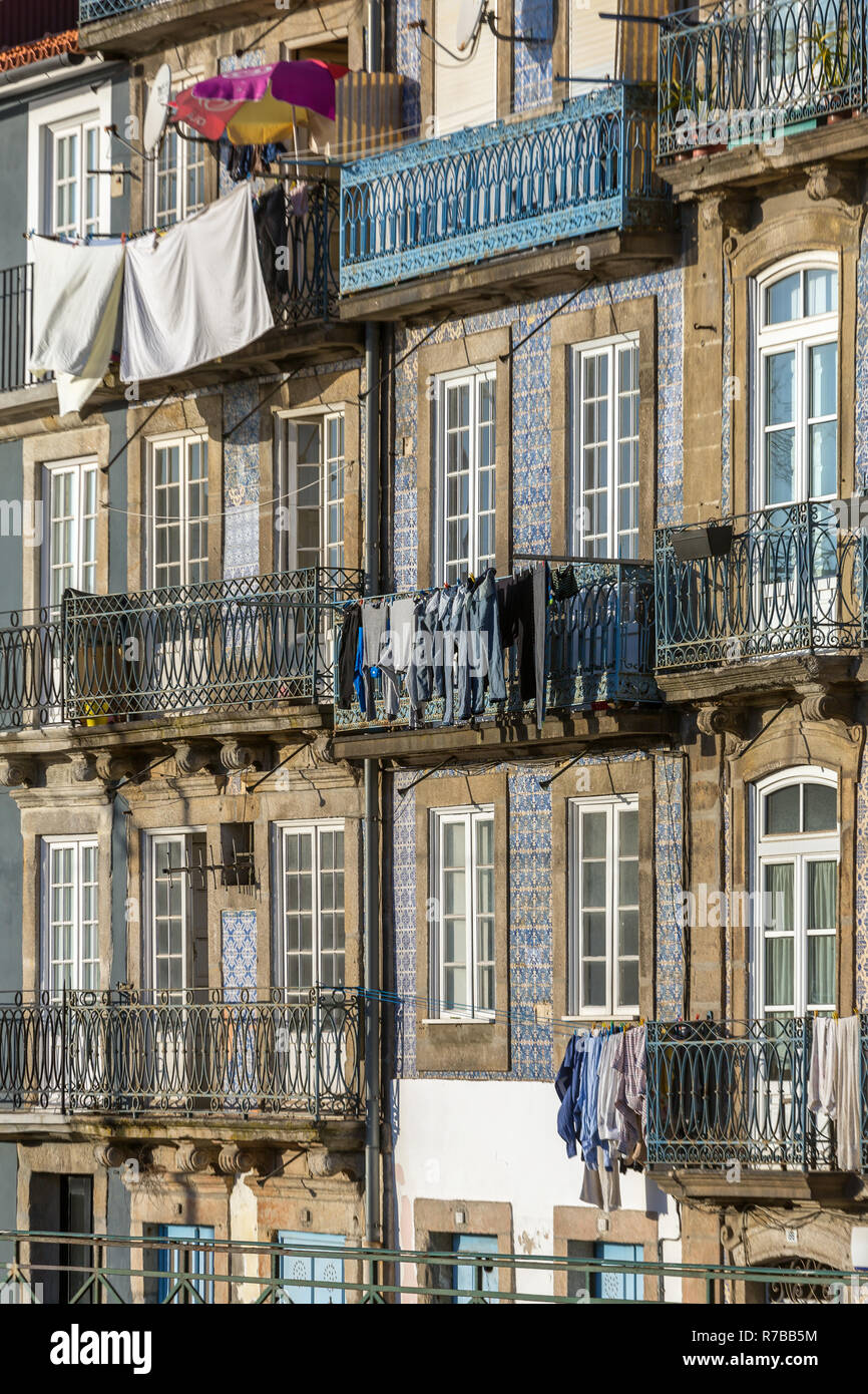 Street view on the beautiful old buildings with portuguese tiles ...
