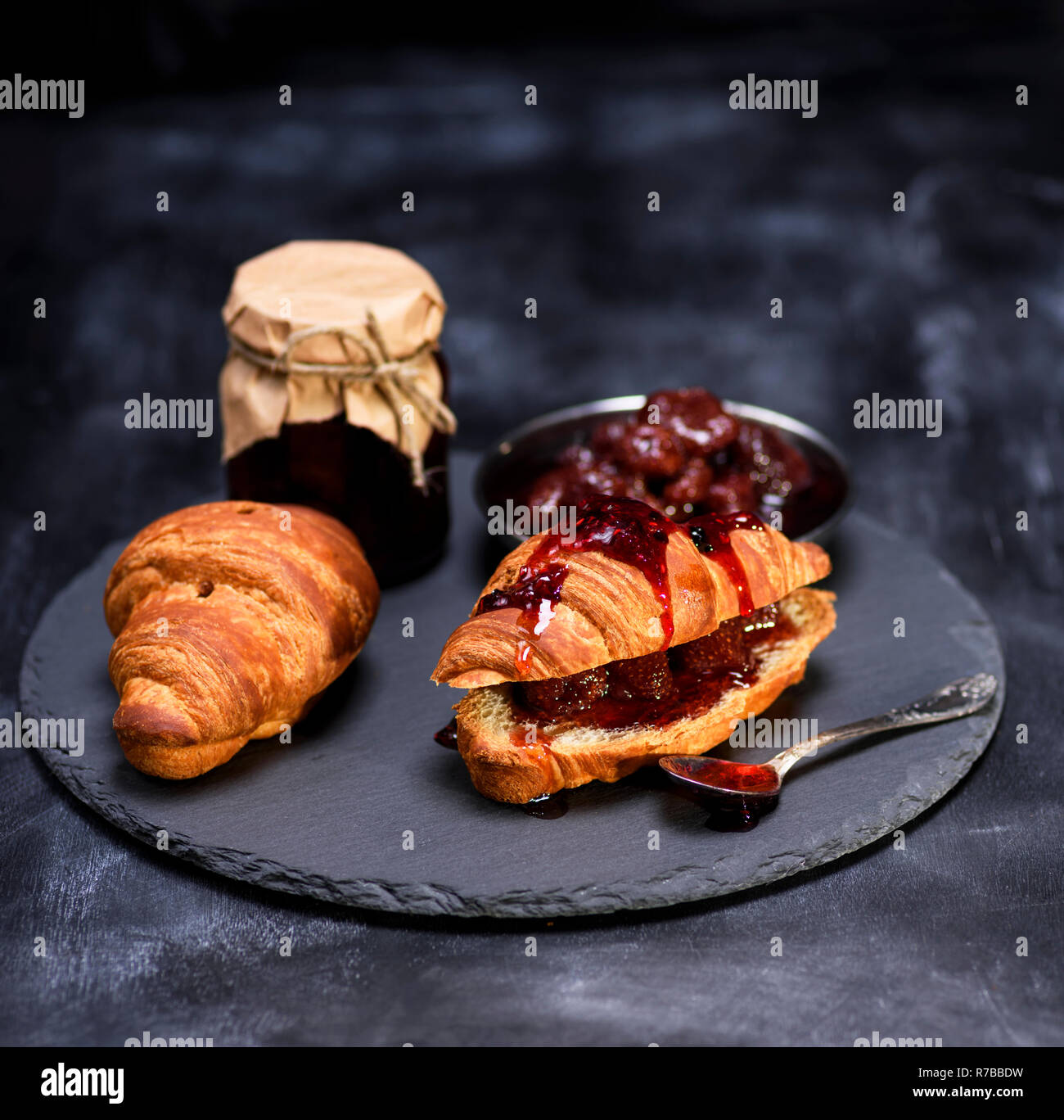 baked croissants with strawberry jam Stock Photo - Alamy