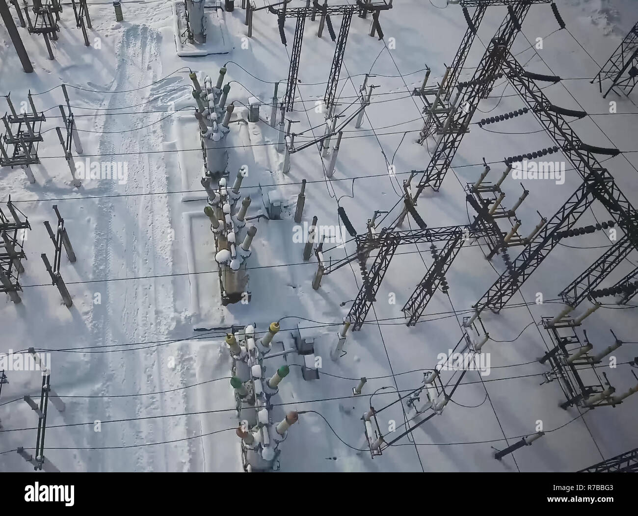 Electrical substation in the snow in winter. High voltage wires Stock ...