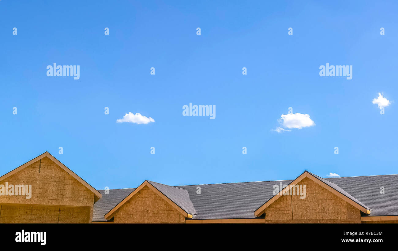 Roof of a home with sky and clouds background Stock Photo - Alamy