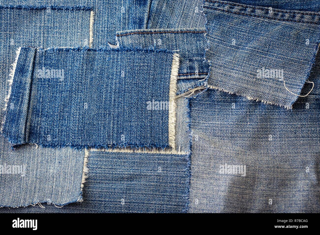 background made of old jeans rags close up Stock Photo - Alamy