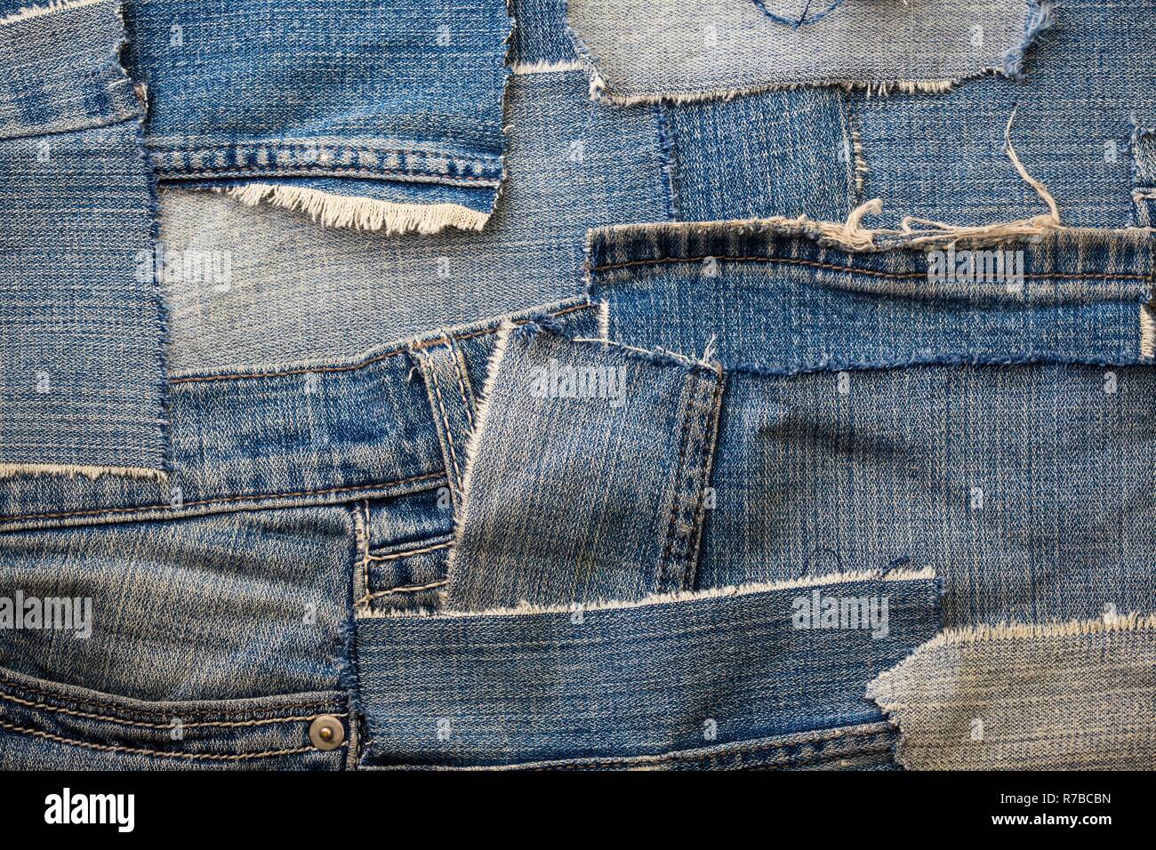 background made of old jeans rags close up Stock Photo - Alamy