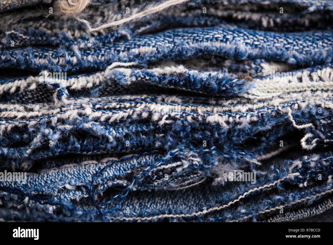 background made of old jeans rags close up Stock Photo - Alamy