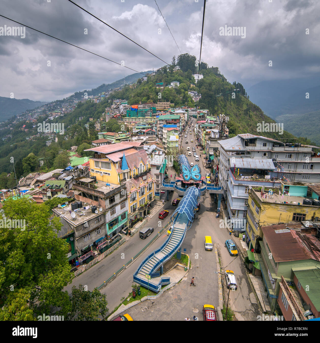 Aerial view of Gangtok city seen from cable car at cloudy day in Sikkim ...