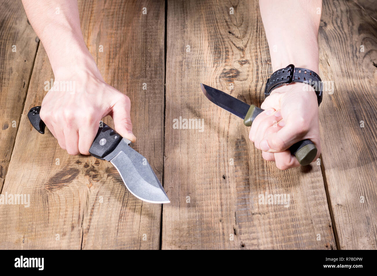 Two knives in hand. Attack with two knives. A knife in each hand Stock ...
