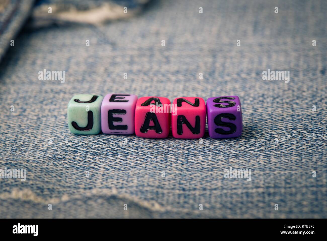 cubes with letters jeans on a jeans background Stock Photo - Alamy