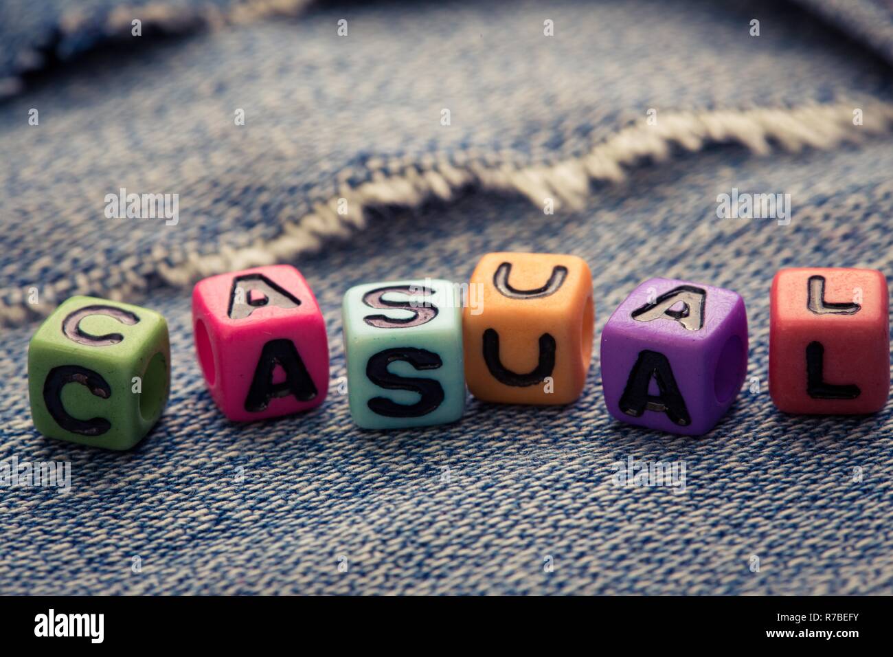cubes with letters casual jeans on a jeans background Stock Photo - Alamy