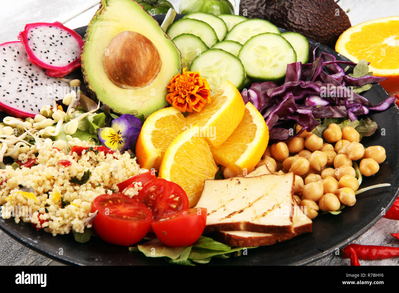 grilled tofu and dragon fruit buddha bowl with vegetable and humus ...