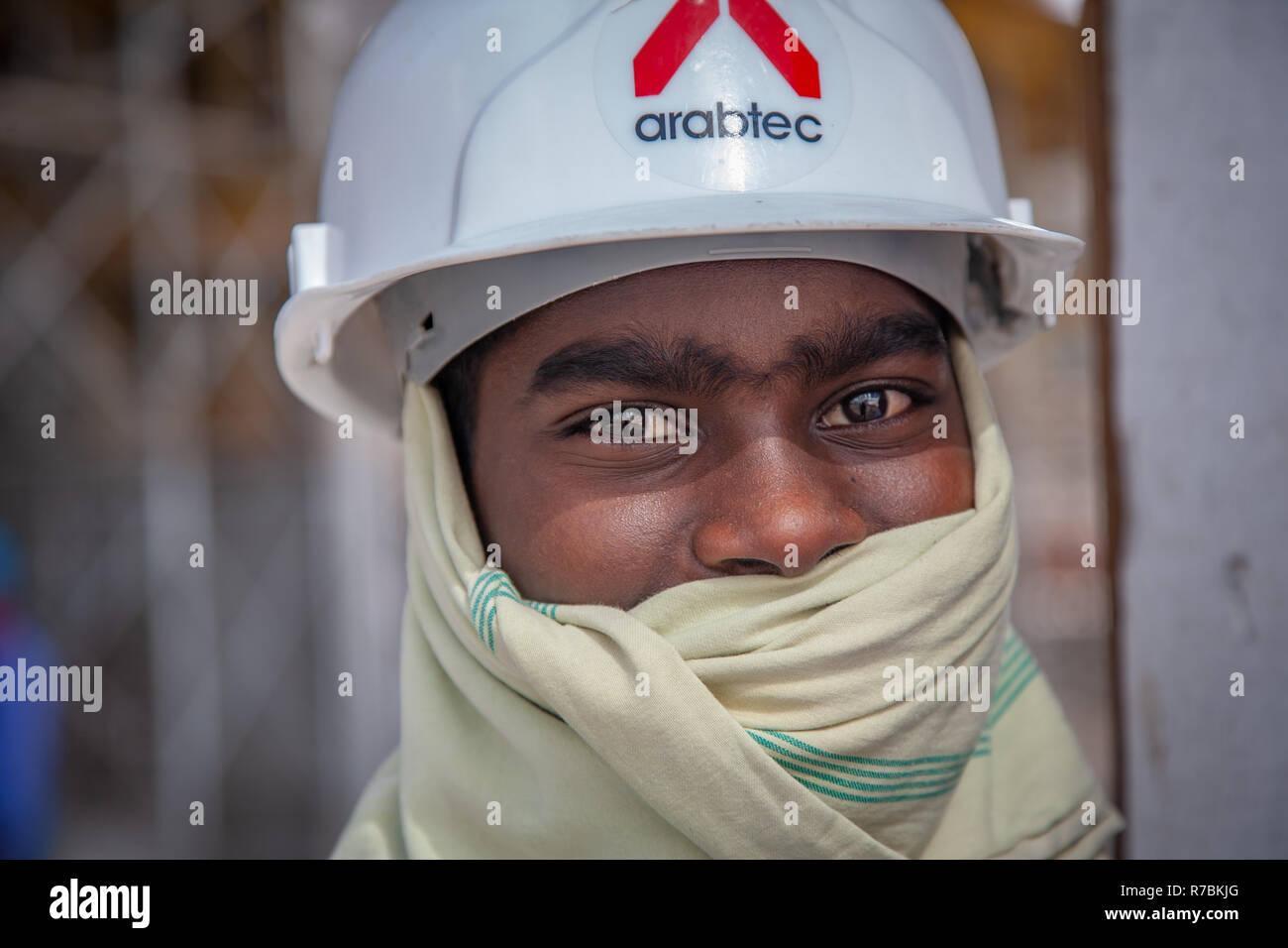 Smiling construction worker on a building site in Dubai, UAE Stock ...