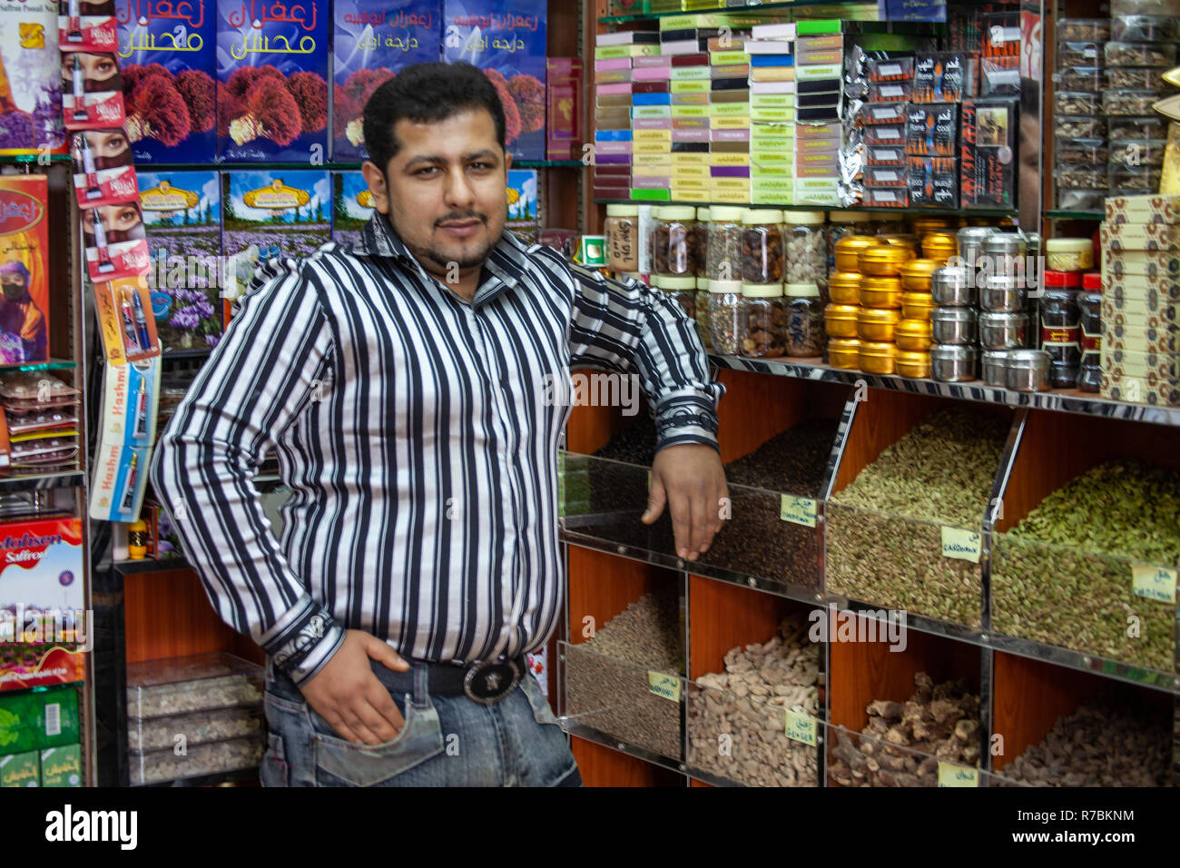 Shop Keeper near his shop in the Gold Souk in Dubai Stock Photo - Alamy