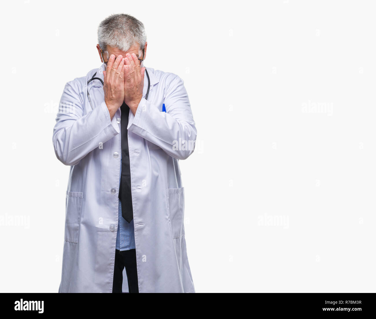 Handsome senior doctor man over isolated background with sad expression ...