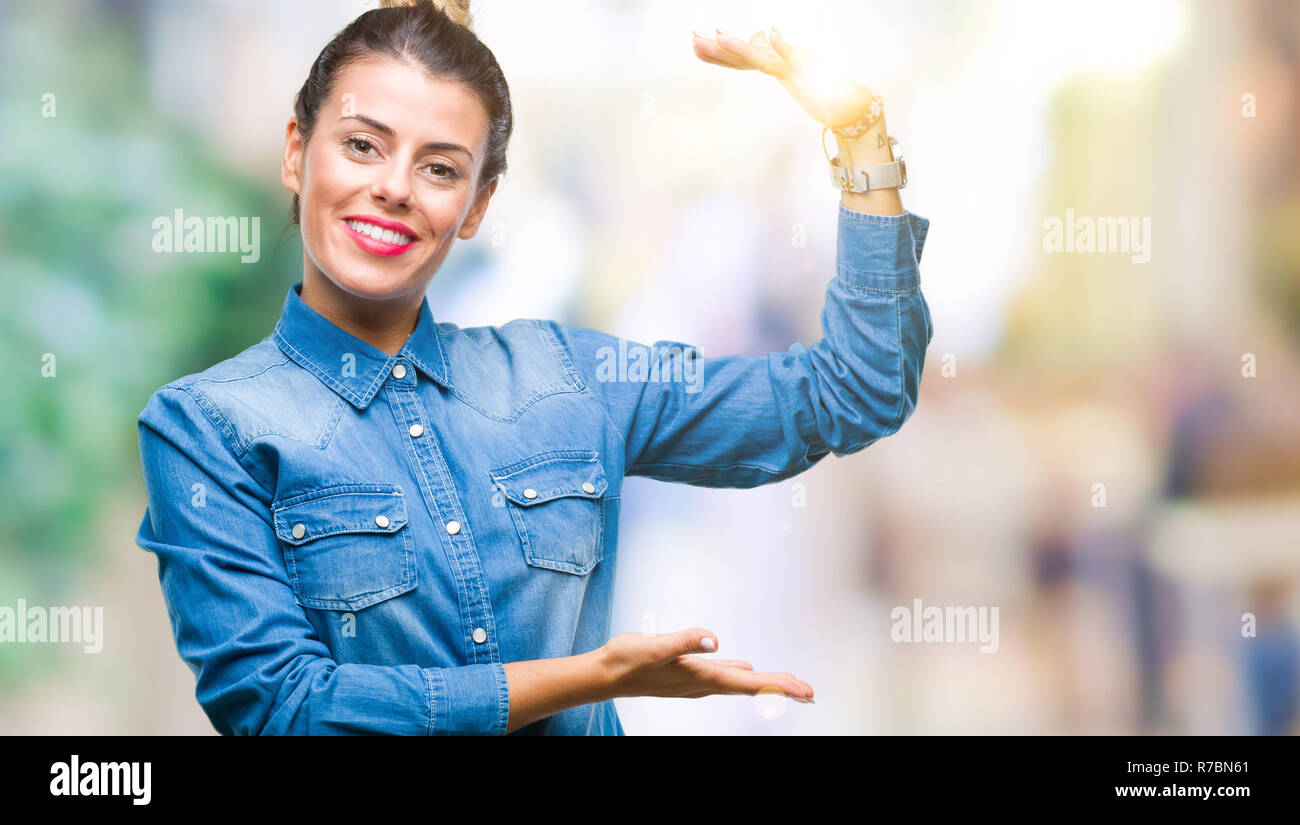 Young beautiful woman over isolated background gesturing with hands ...