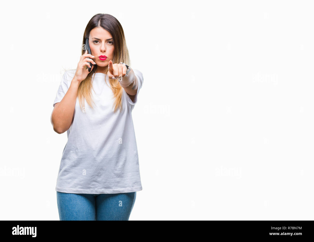 Young beautiful woman speaking calling using smartphone over isolated ...