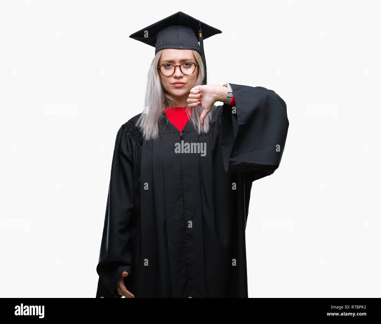 Young blonde woman wearing graduate uniform over isolated background ...