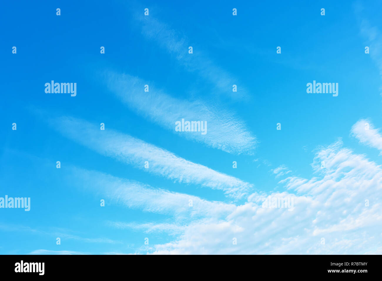 Angel's wing - Blue sky with mystic fancy clouds Stock Photo - Alamy