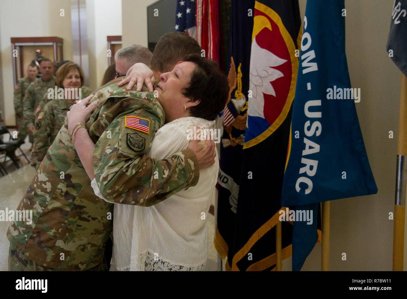 Maj. Gen. David Conboy hugs Mrs. Judith Engle during a relinquishment ...