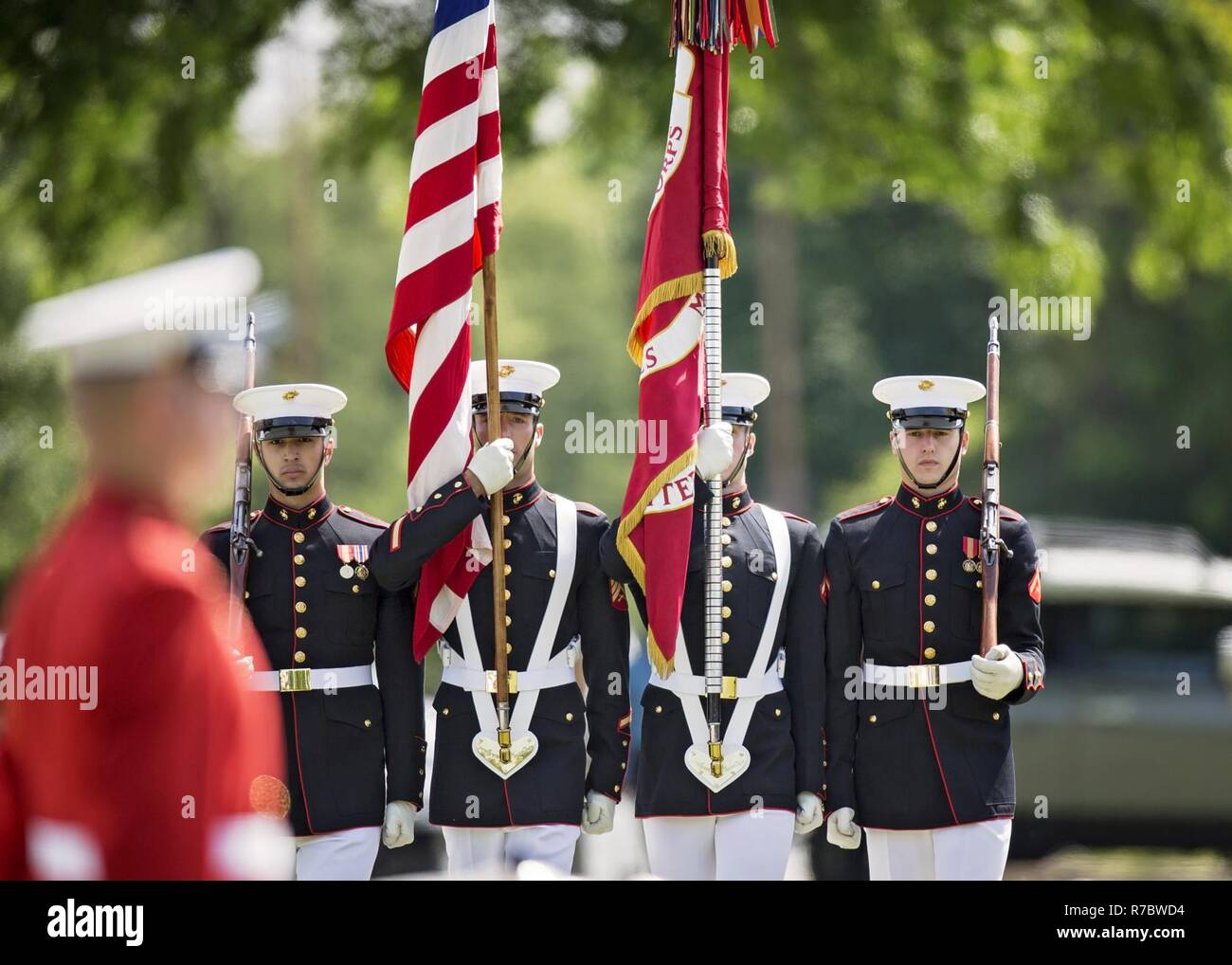 The U.S. Marine Corps Quantico Color Guard march on the colors during ...