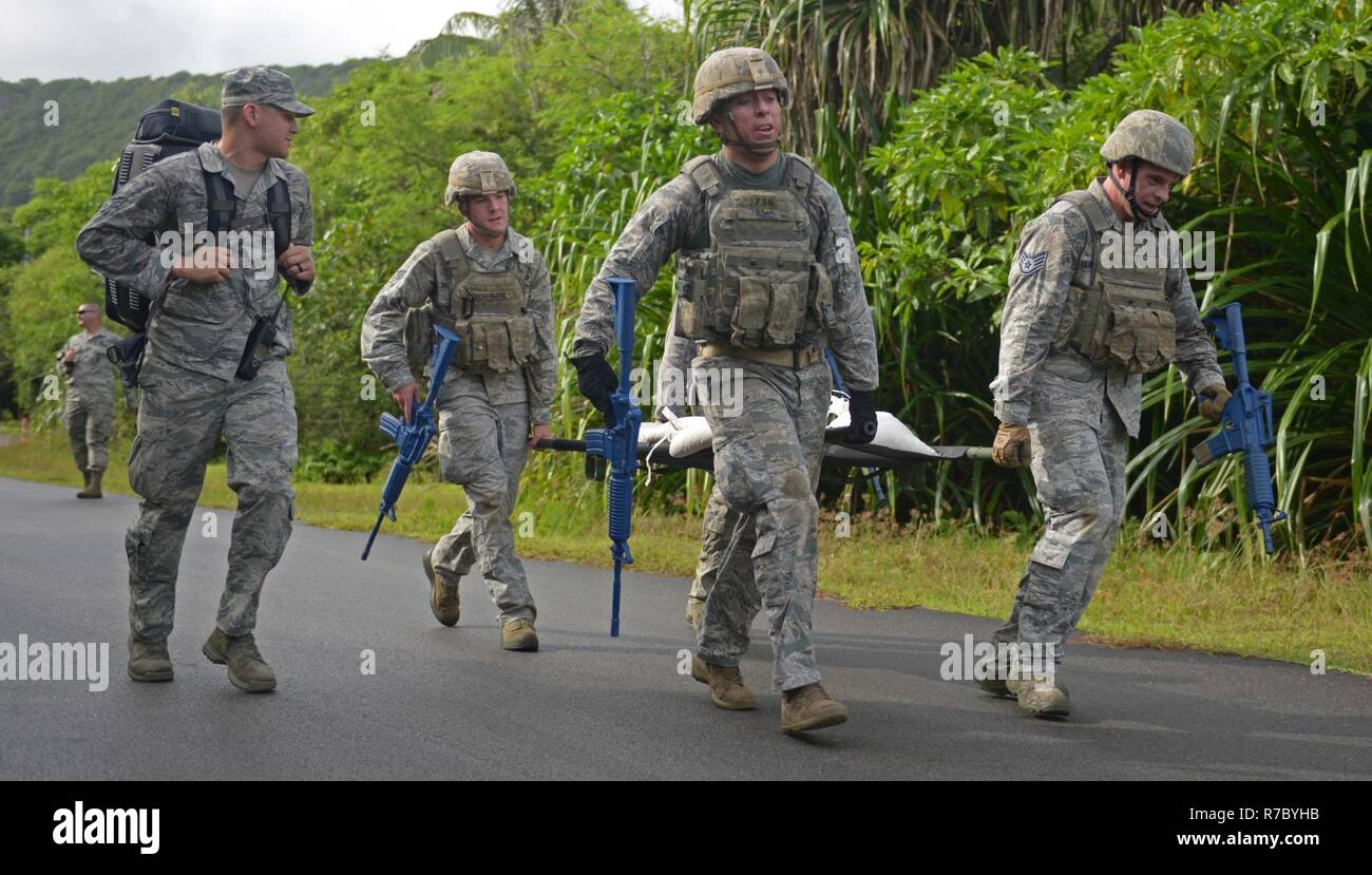 Airmen from the 736th Security Forces Squadron carry a litter during ...