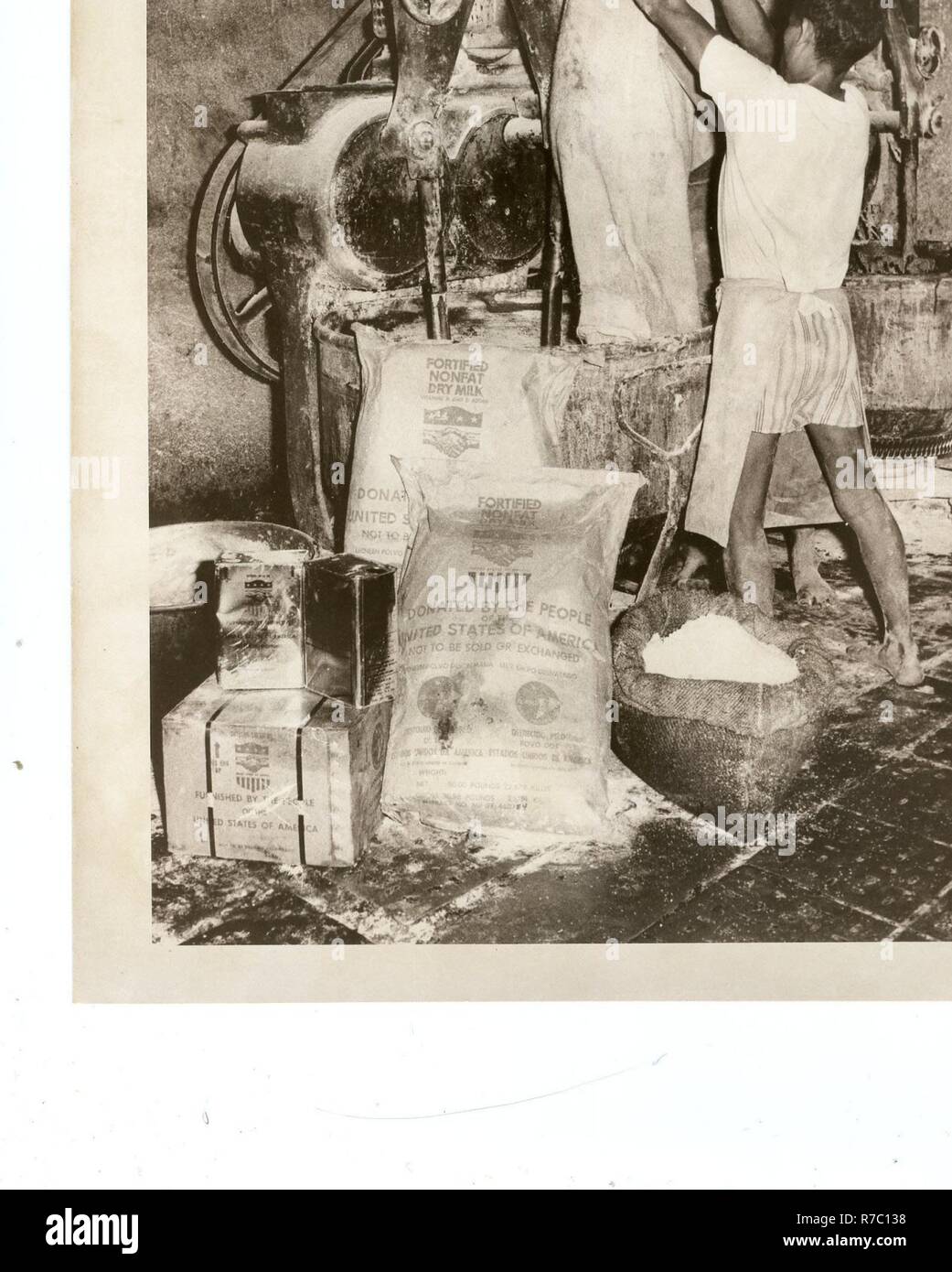 A LITTLE BOY WORKING IN A FACTORY Stock Photo - Alamy