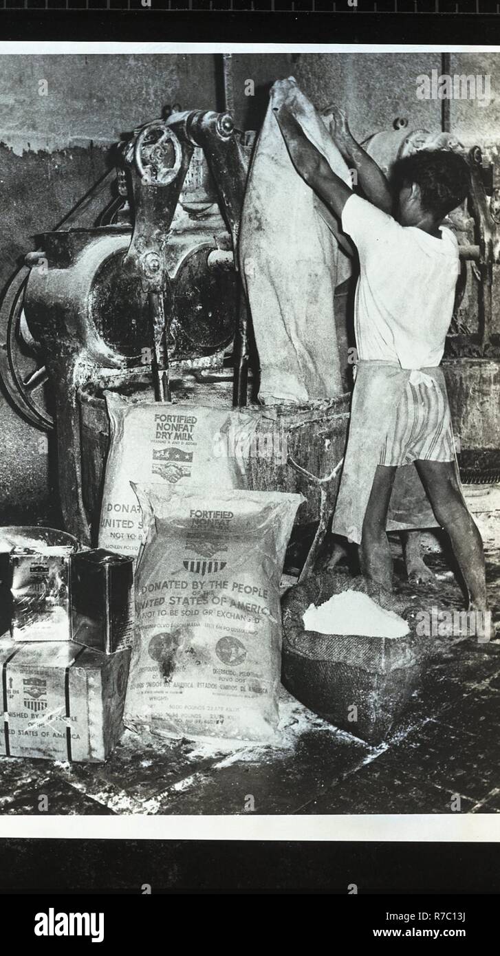 A LITTLE BOY WORKING IN A FACTORY Stock Photo - Alamy