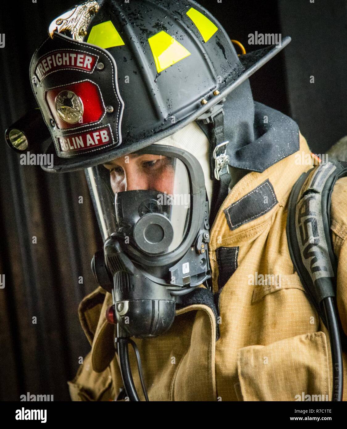 An Eglin Air Force Base firefighter waits to begin a live burn exercise ...