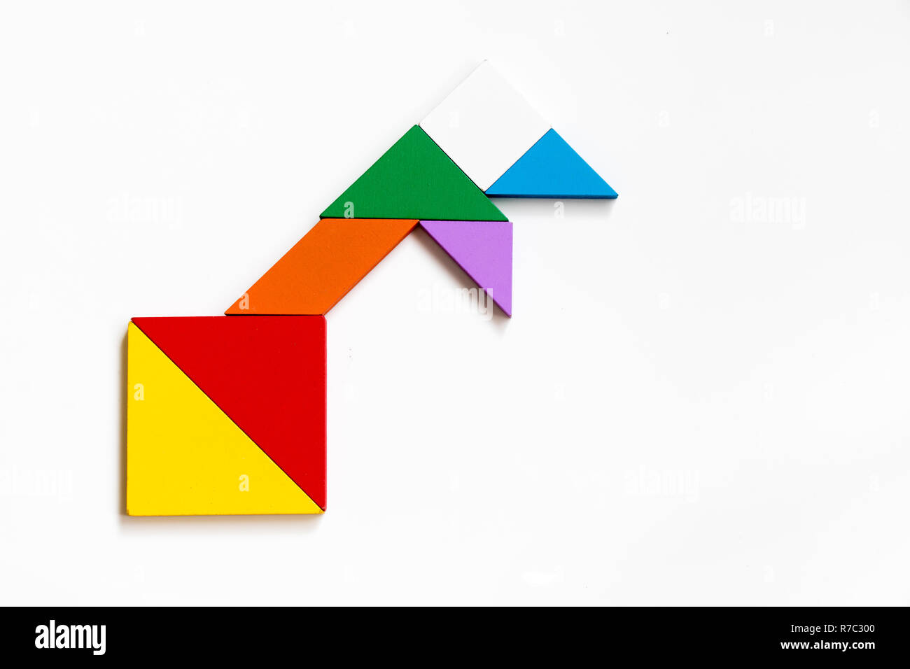 Colorful wood tangram puzzle in key shape on white background Stock ...