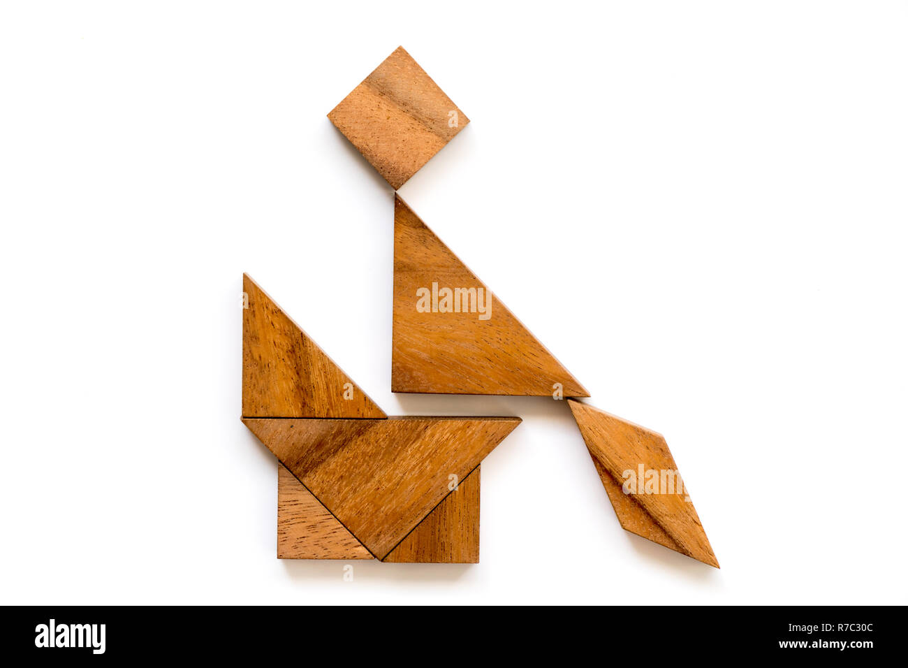 Wood tangram puzzle in man sitting on chair or toilet in restroom shape ...
